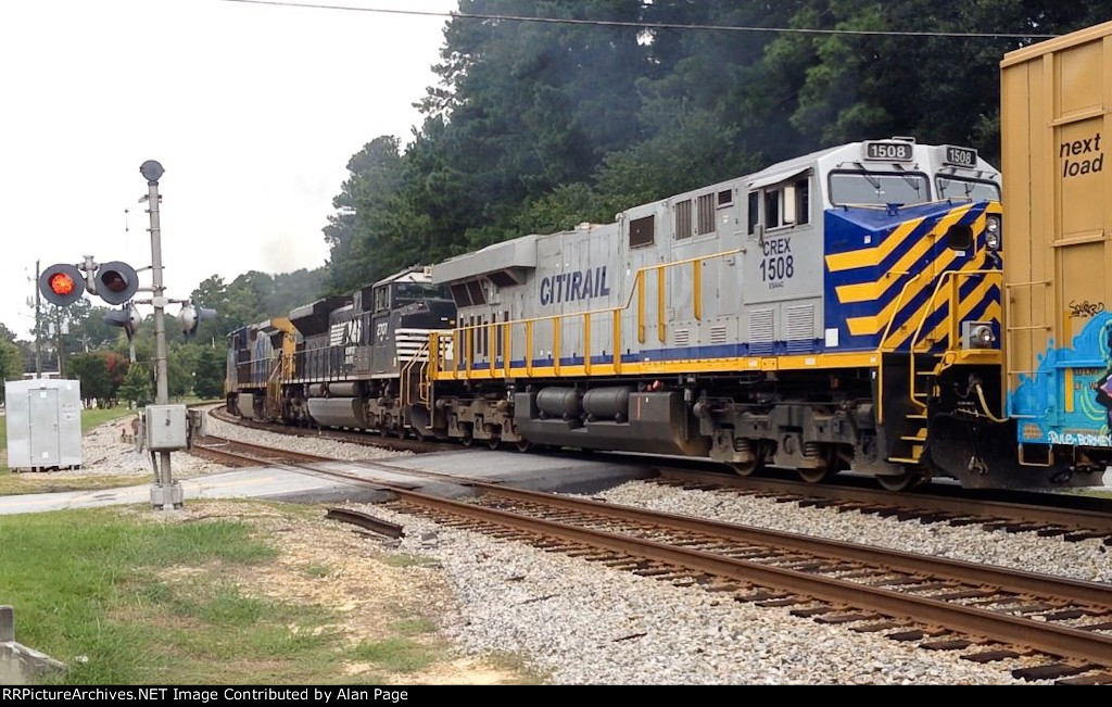 CREX ES44AC 1508 and NS SD70M 2707 give assist to CSX C40-8W 7859